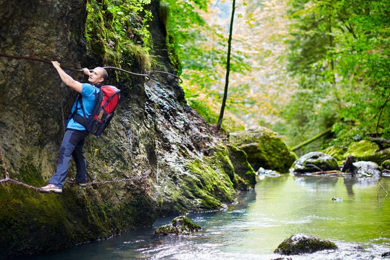 Man climbing mountain wall stock photo. Image of danger - 36439996