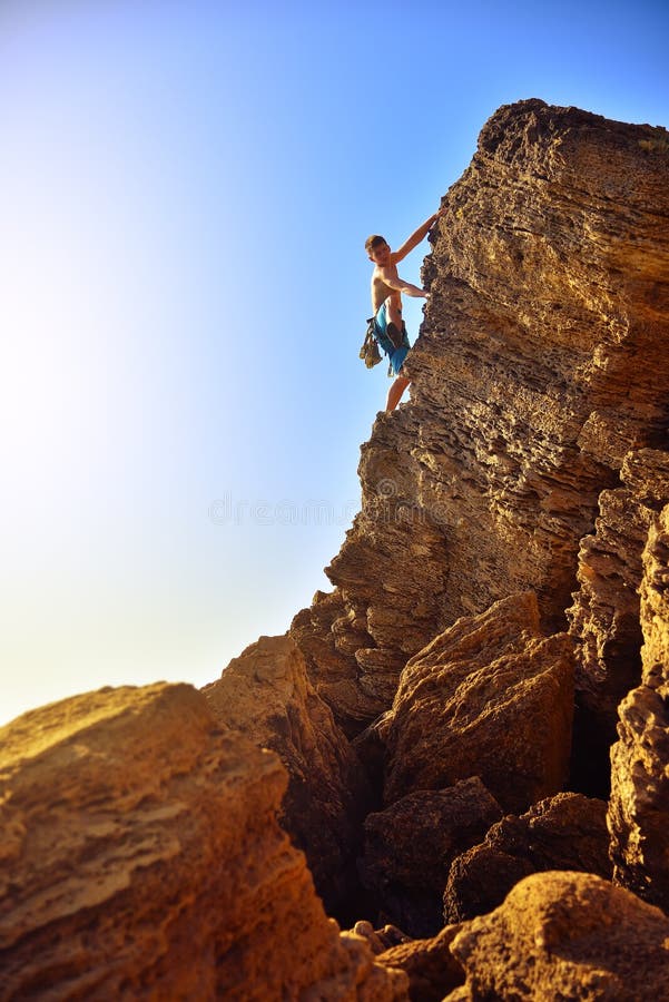 Man climbing on Mountain stock image. Image of endurance - 75407257