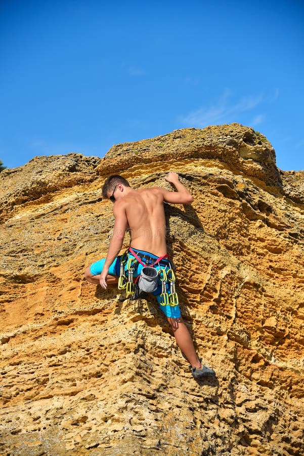 Man Climbing Up on Mountain Stock Photo - Image of challenge, action ...