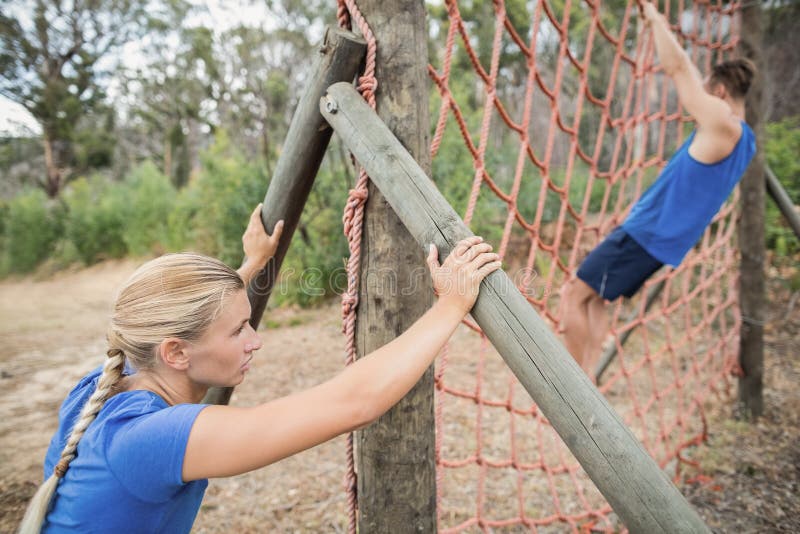 Man Climbing a Net during Obstacle Course Stock Image - Image of ...