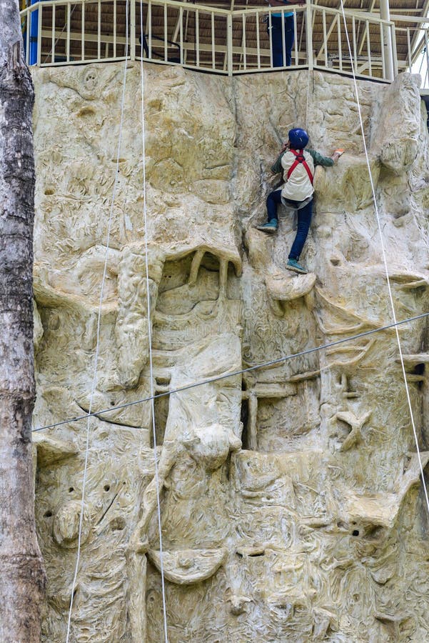 Man Climbing with Rock Climbing Simulator Stock Image - Image of ...