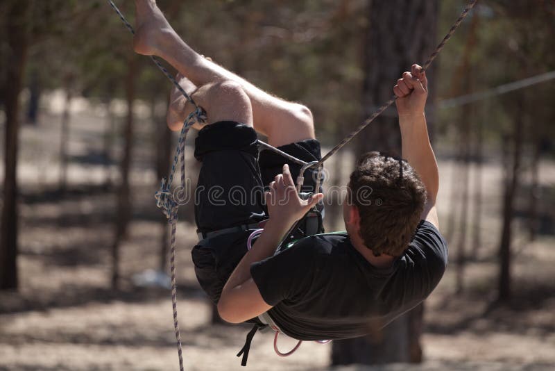 Man climbing on rope stock photo. Image of hanging, activity - 29128642