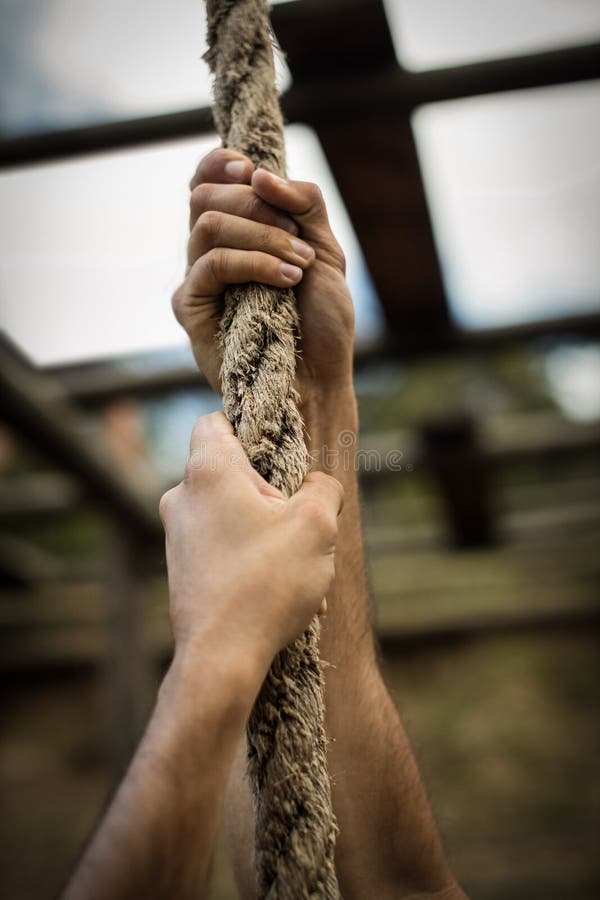 Man Climbing a Rope during Obstacle Course Stock Photo - Image of ...
