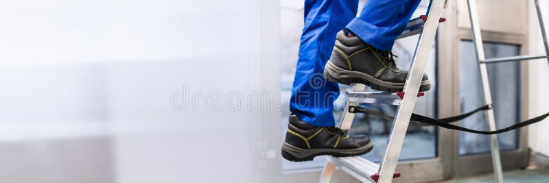 Man Climbing Step Ladder stock photo. Image of space - 249210792
