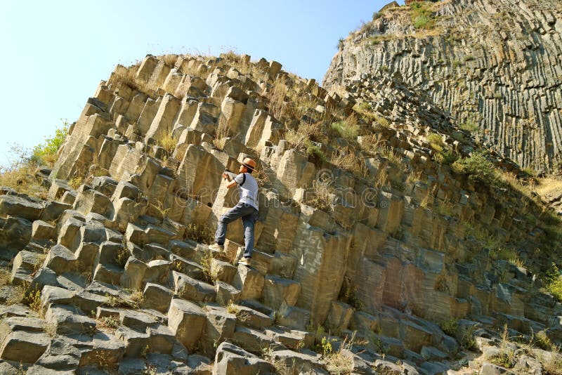 Man Climbing the Symphony of Stones, Massive Basalt Column Formations ...