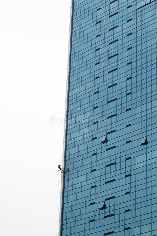 Man Climbing on a Tall Building in Singapore Stock Photo - Image of ...