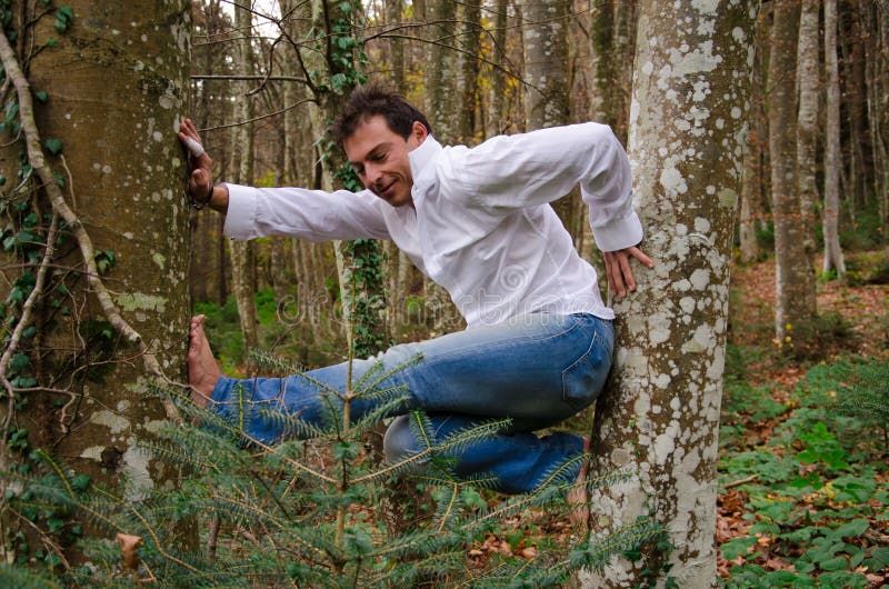 Man climbing on a tree stock photo. Image of climb, smiley - 47118956