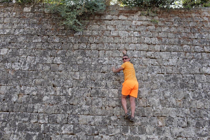 Man climbing on wall stock photo. Image of museum, landmark - 27323392