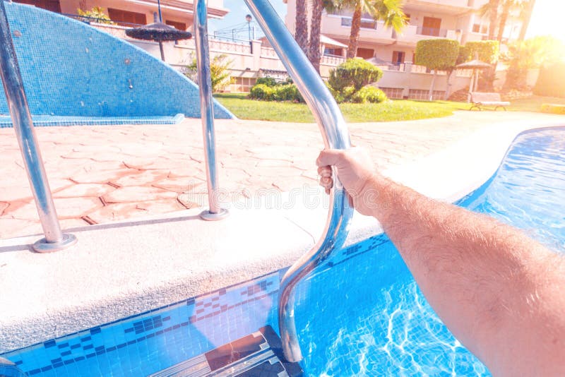 A Man Climbs Out of the Pool Stock Image - Image of sport, resort ...