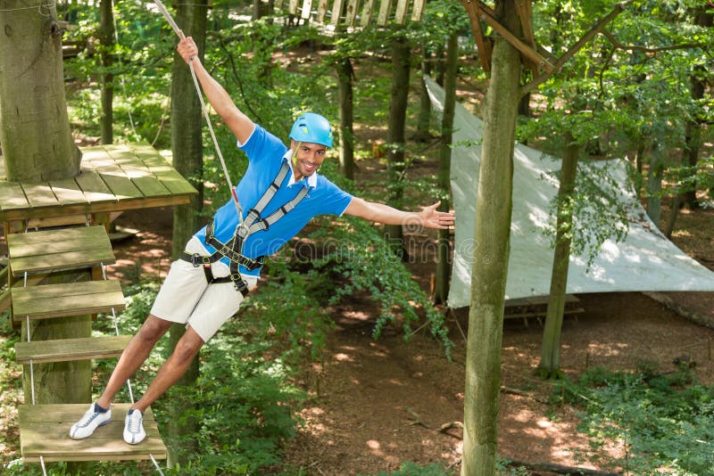 Man Climbs Over Obstacles at High Rope Court Stock Image - Image of ...
