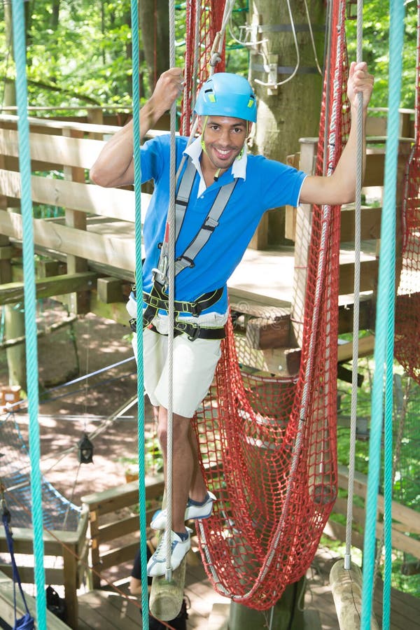 Man Climbs Over Obstacles at High Rope Court Stock Image - Image of ...
