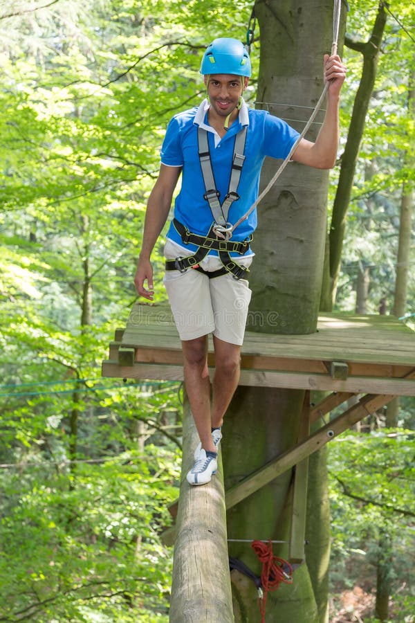 Man Climbs Over Obstacles at High Rope Court Stock Image - Image of ...