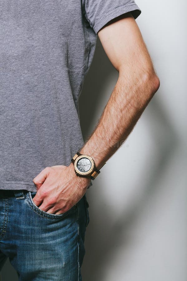 A Man with a Clock on His Hand Stock Image - Image of males, arranging ...