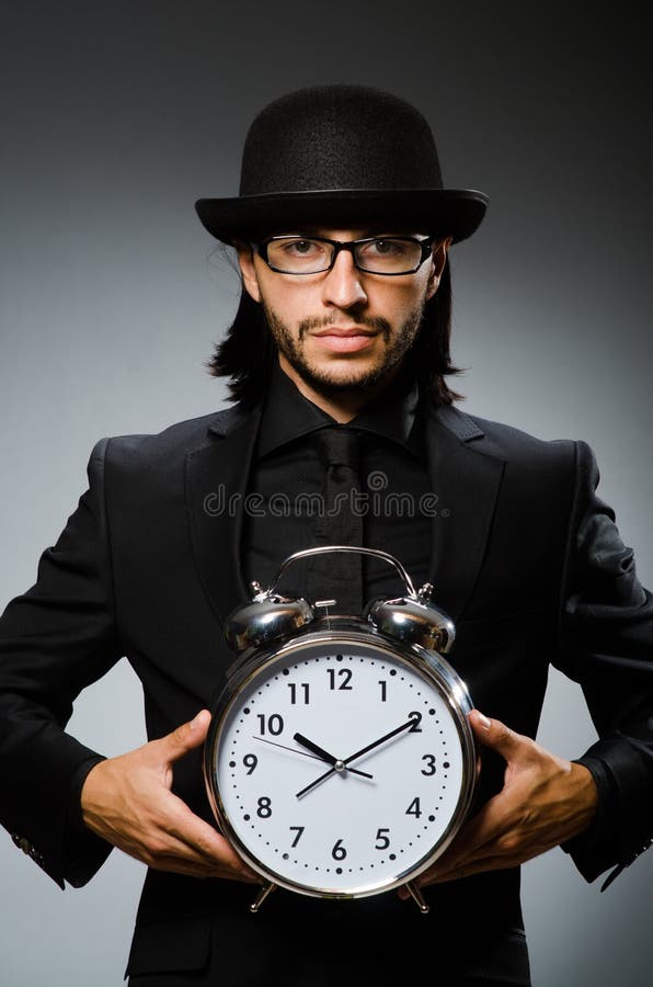 Man with clock wearing stock photo. Image of classic - 46295628