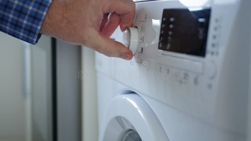 Laundry Machine Spinning and Clean Wet Clothes with Water and Detergent ...