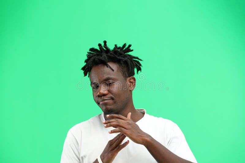 A Man, Close-up, on a Green Background, Shows a Pause Sign Stock Image ...