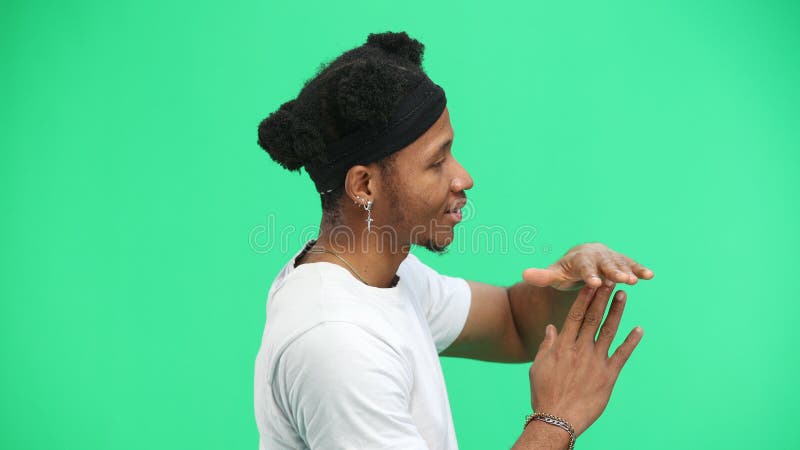 A Man, Close-up, on a Green Background, Shows a Pause Sign Stock Image ...