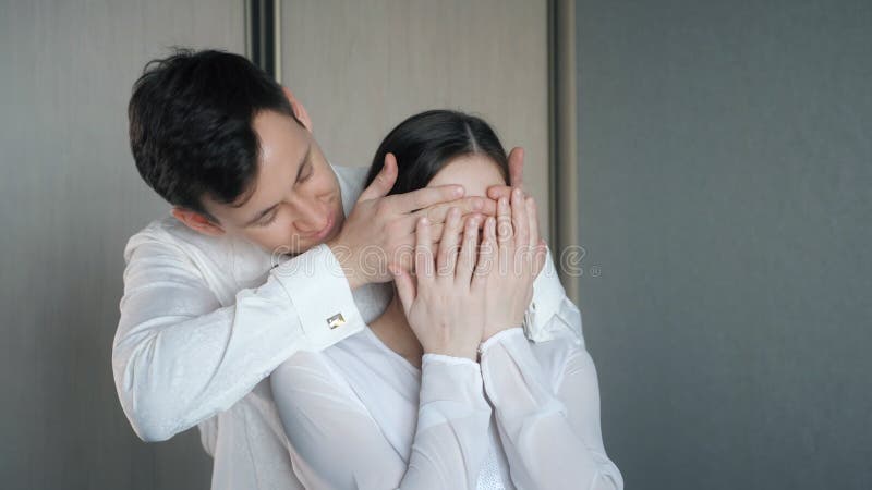 Man Closes His Is Girlfriend`s Eyes To Make Surprise Stock Footage