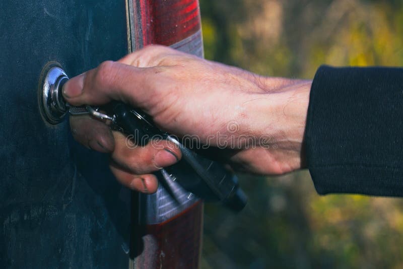 Man Closes or Opens the Trunk of the Car with a Key Stock Image - Image ...