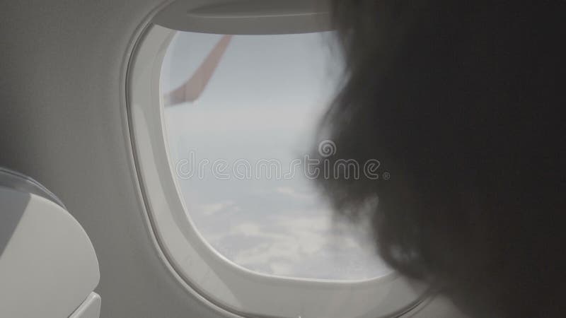 Man Closes the Window Shutter on Plane Stock Footage - Video of light ...