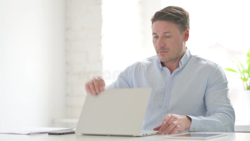 Man Closing Laptop Standing Up after Work Stock Photo - Image of ...