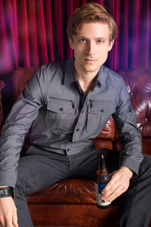 Man at club stock image. Image of home, leather, beverage - 53886781