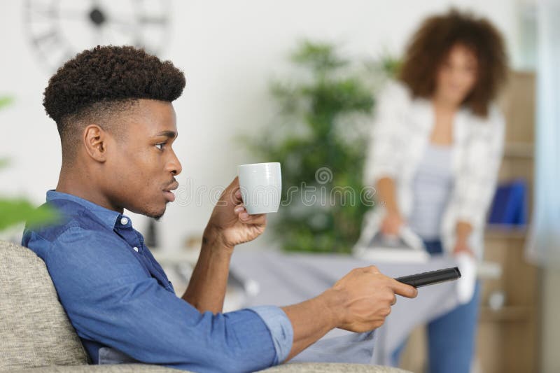 Man with Coffee and Remote Control in Hand Stock Image - Image of food ...