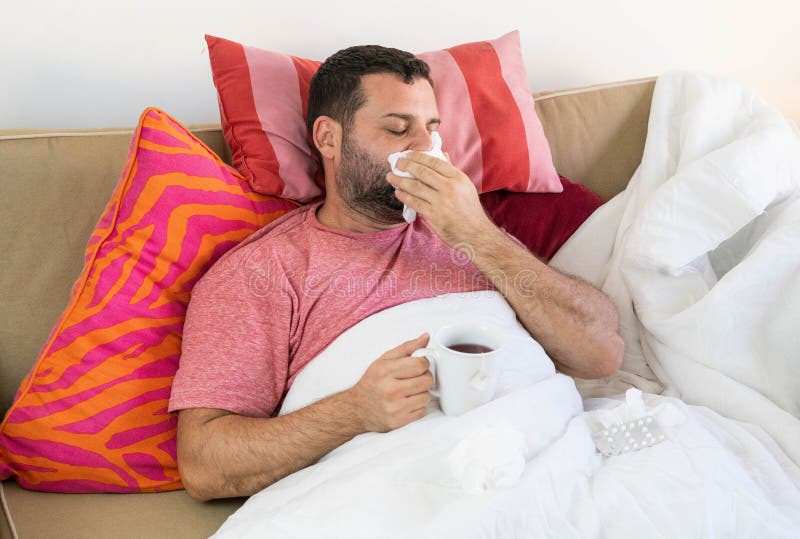 Man with a Cold and Positive for Coronavirus, Drinking a Tea Stock ...