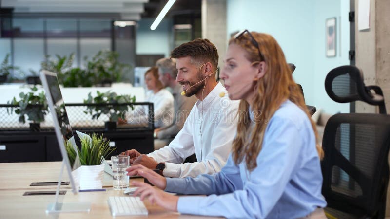 Man and Colleagues in a Call Center Office for Customer Service Help ...