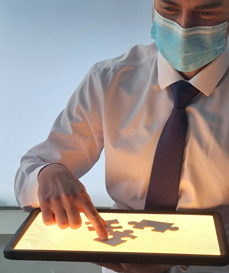Man Collecting Puzzle Pieces on a Graphic Tablet . Stock Image - Image ...