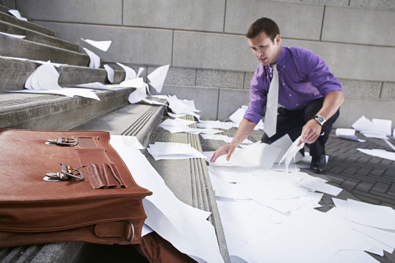 Man Collecting Spilled Paperwork from Steps Stock Image - Image of ...