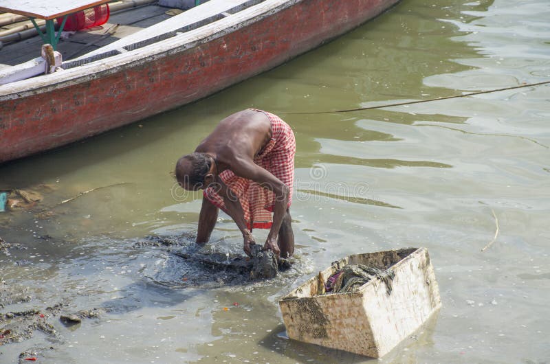 Man Collects Garbage in Bags on the Sidewalk. the Concept of Cleaning ...