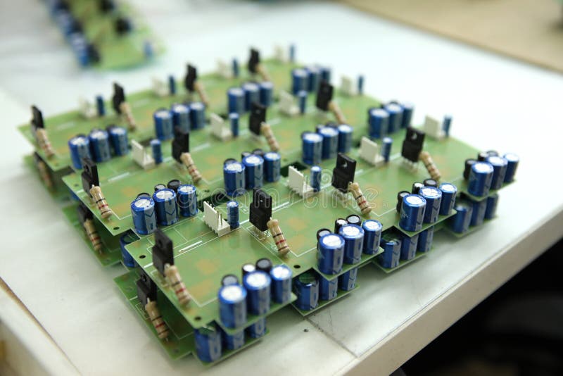 A Man Collects a Printed Circuit Board. the Worker Solders the Radio ...