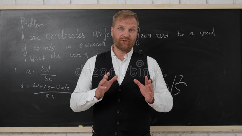 Man College Teacher in Classroom in Front of Chalkboard Explaining ...