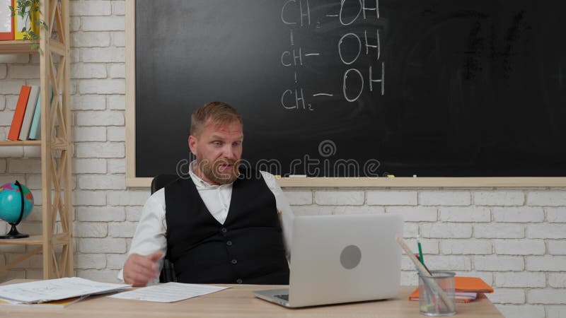 Man College Teacher Sit at Desk in Classroom in Front of Chalkboard ...