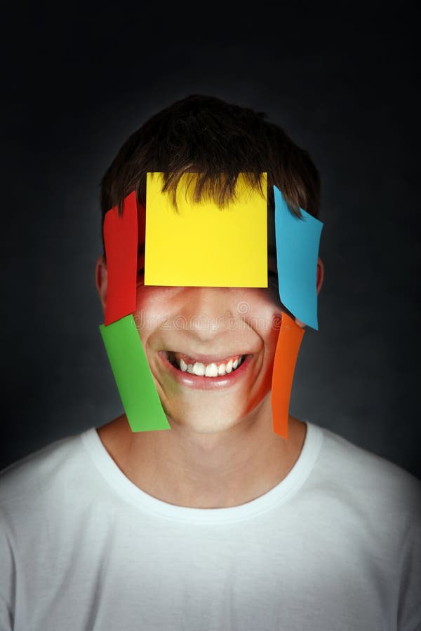 Man with Colored Paper on Face Stock Photo - Image of male, forehead ...