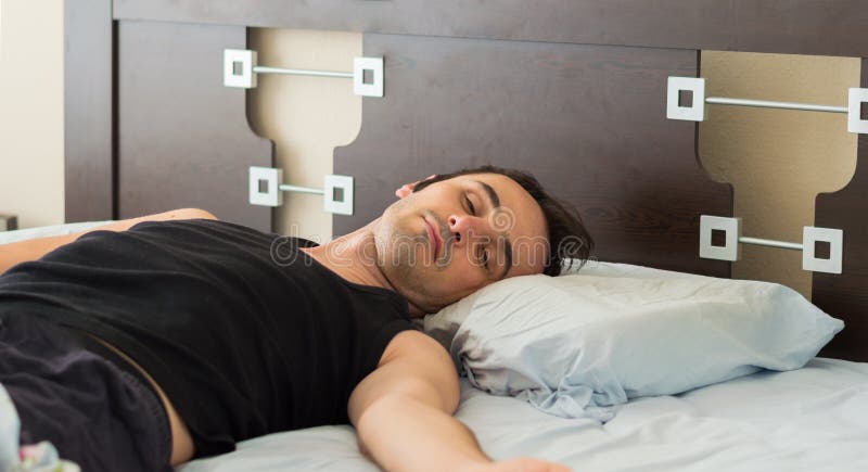 Man Comfortably Resting in His Bed in the Morning Stock Photo - Image ...