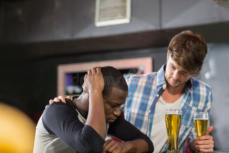 Man comforting his friend stock photo. Image of friend - 68299250