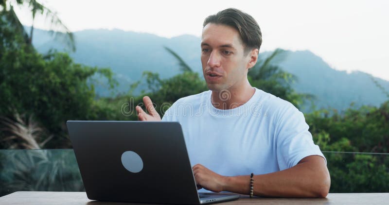 Man Communicates through Webcam with Remote Employees, Sitting on ...