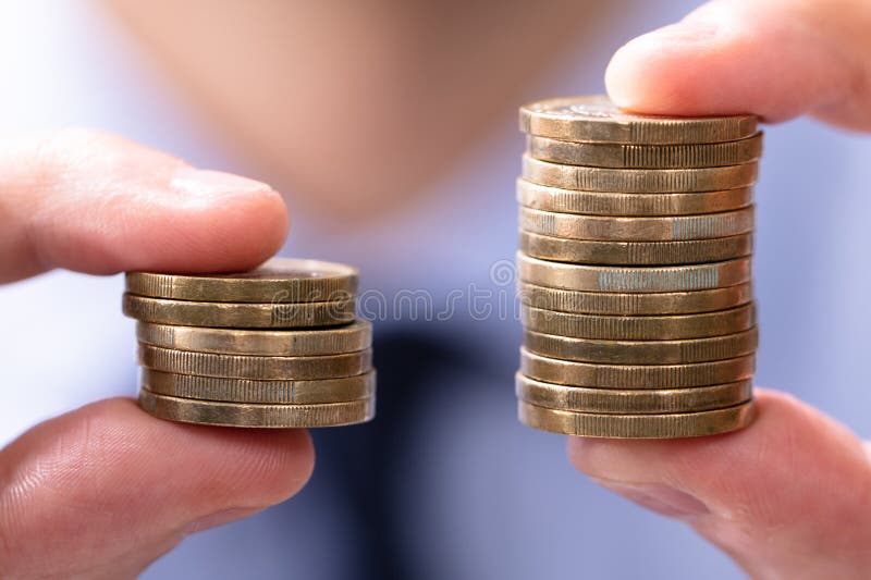 Man Comparing Two Coin Stacks Stock Image - Image of coin, discriminate ...