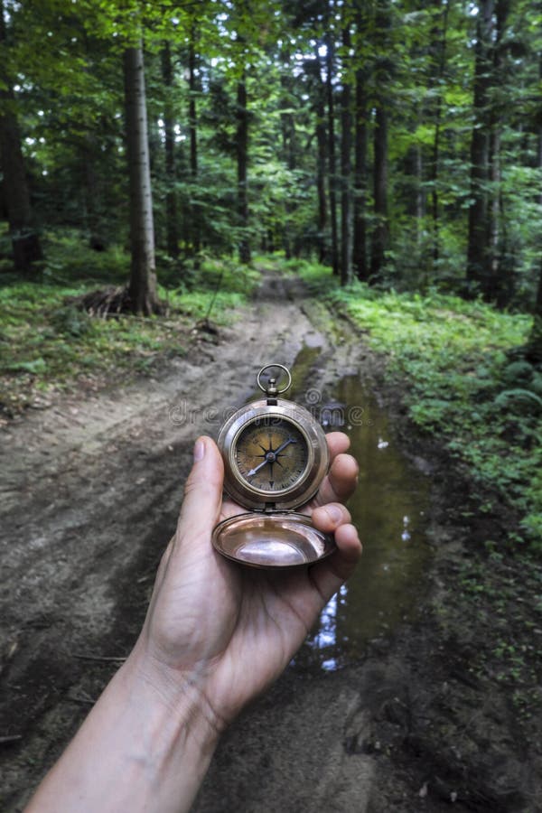 Man with compass in hand stock photo. Image of hiking - 118823524