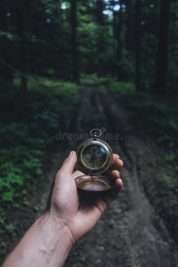 Man with compass in hand stock photo. Image of exploration - 119962252