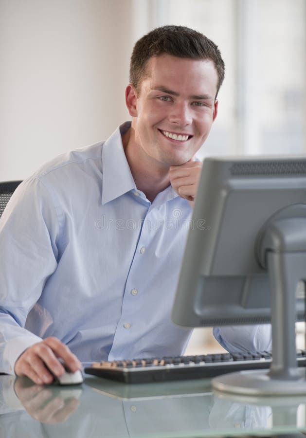 Man on Computer stock image. Image of midlife, sitting - 10545539