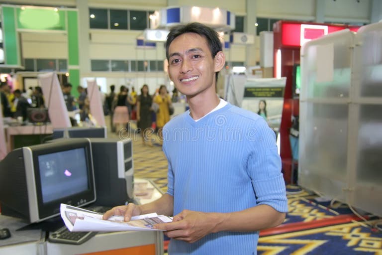 Man in computer fair stock photo. Image of computer, exhibition - 7142650