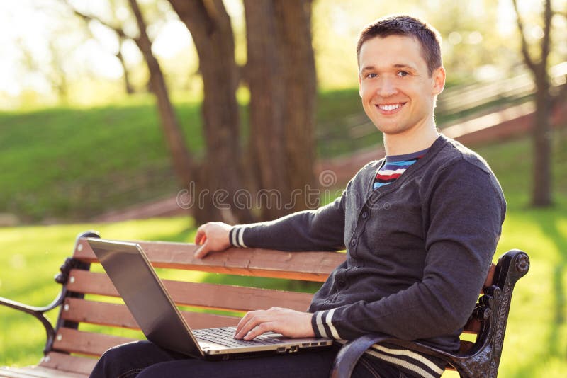 Man with Computer Sitting Bench in Park Stock Image - Image of happy ...