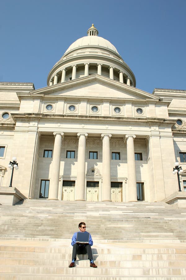 Man and Computer on Stairs stock image. Image of light - 1287723