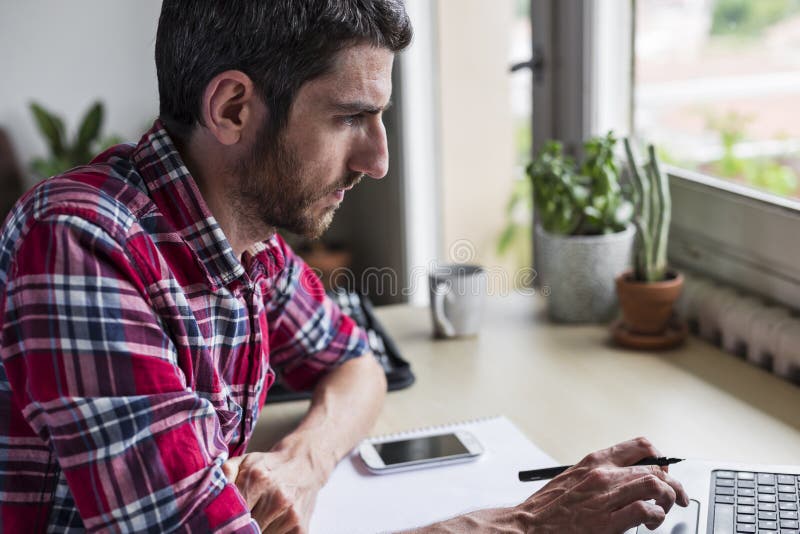 Man concentrating on work stock image. Image of adult - 225951955