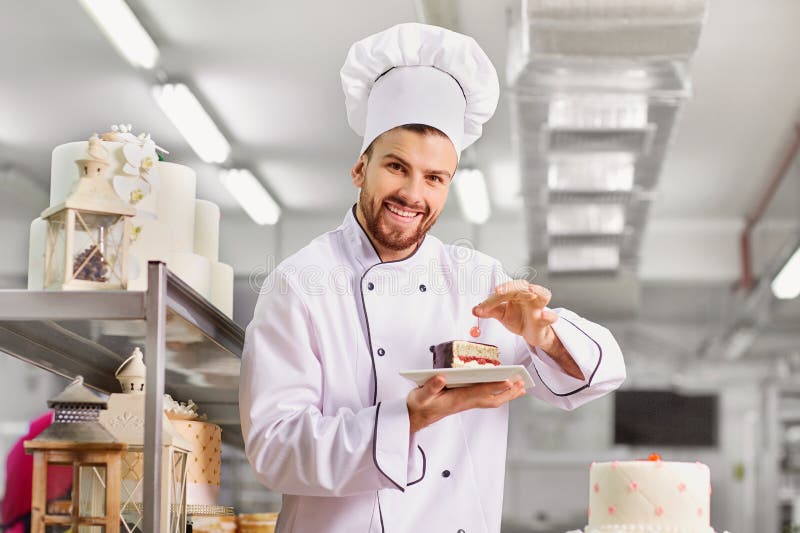 Man Confectioner with a Cake in His Hands in the Pastry. Stock Image ...