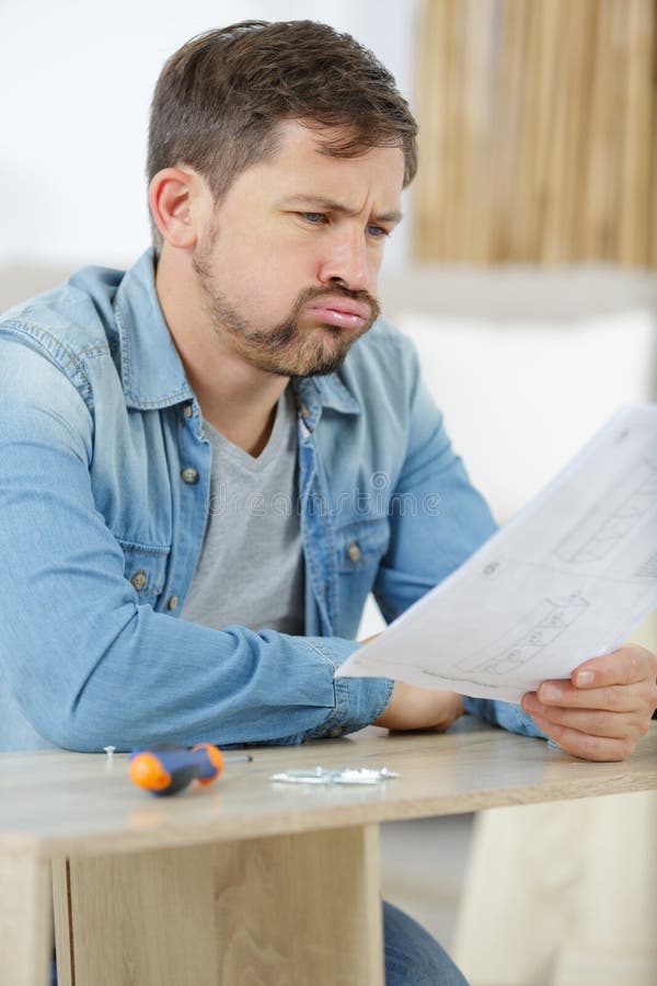 Man reading manual stock photo. Image of defective, service - 174010226
