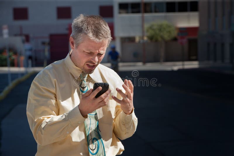 Man is Confused by Message on Cell Phone Stock Image - Image of parking ...